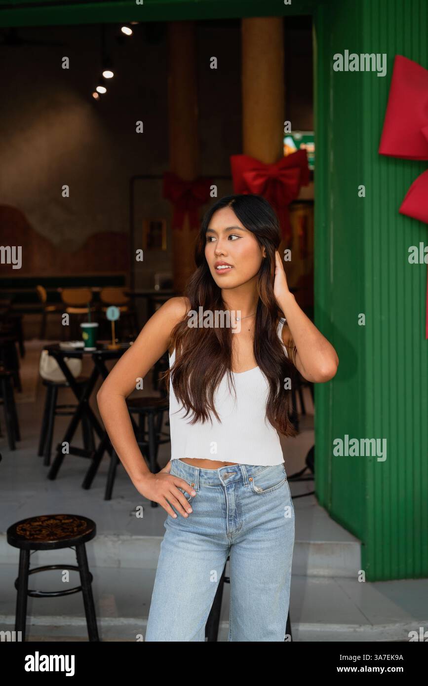 Portrait of beautiful young Asian woman standing in restaurant Stock ...
