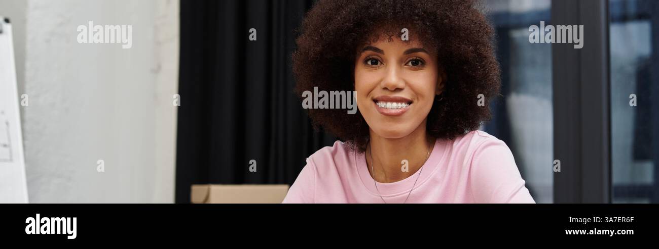 Engaged in packing activities, a cheerful woman prepares boxes in a ...