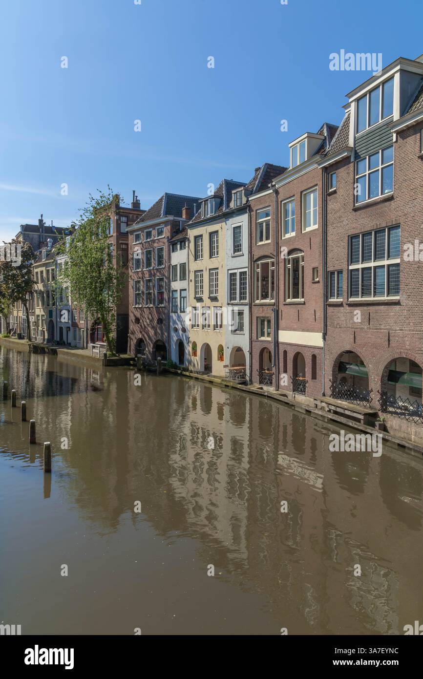 Vertical high canal houses along the Oudegracht canal in Utrecht. A ...