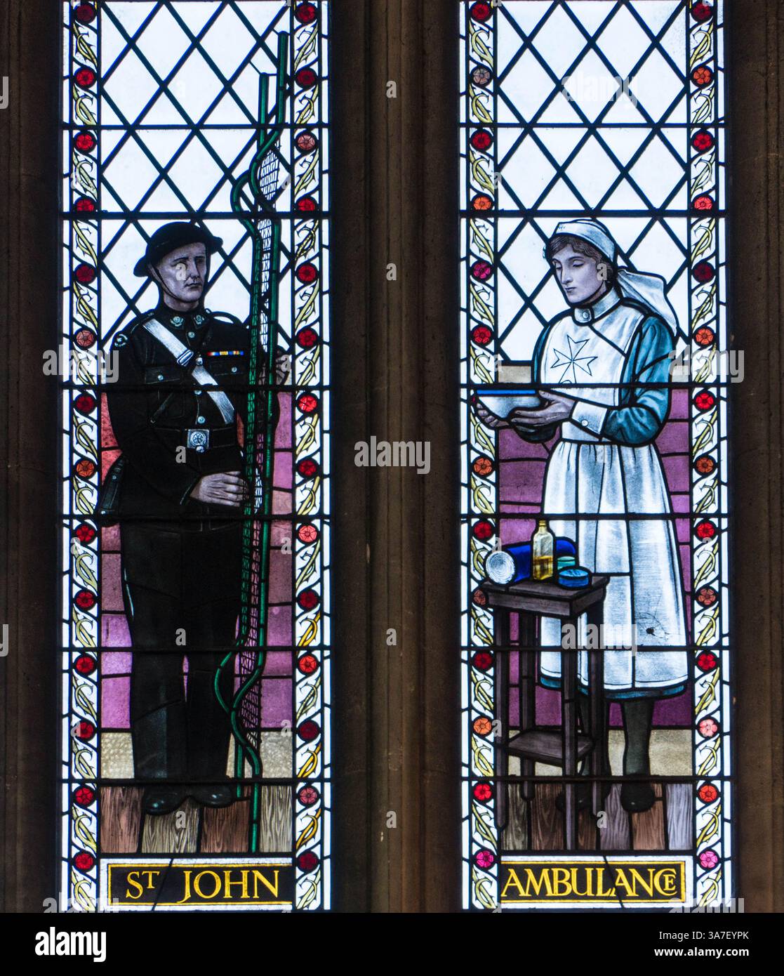 Stained glass depicting two members of St John Ambulance. A male ...