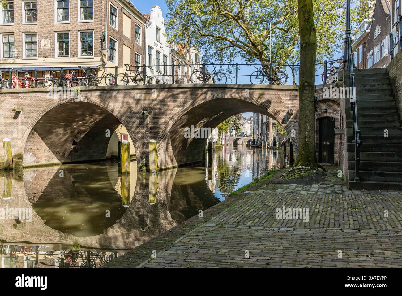 Oudegracht canal in Utrecht with concrete stairs leading up from the ...