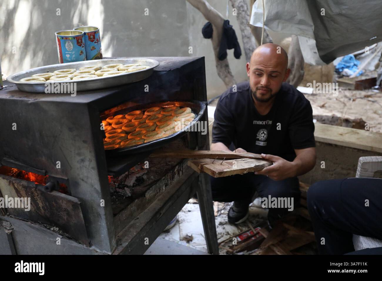 Palestinian families prepare the traditional cookies ahead of Eid al ...