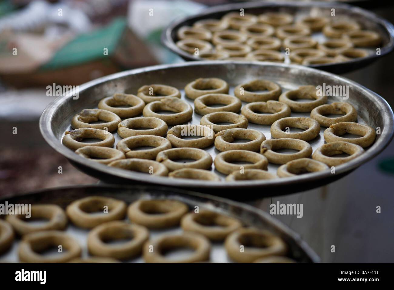 Palestinian families prepare the traditional cookies ahead of Eid al ...