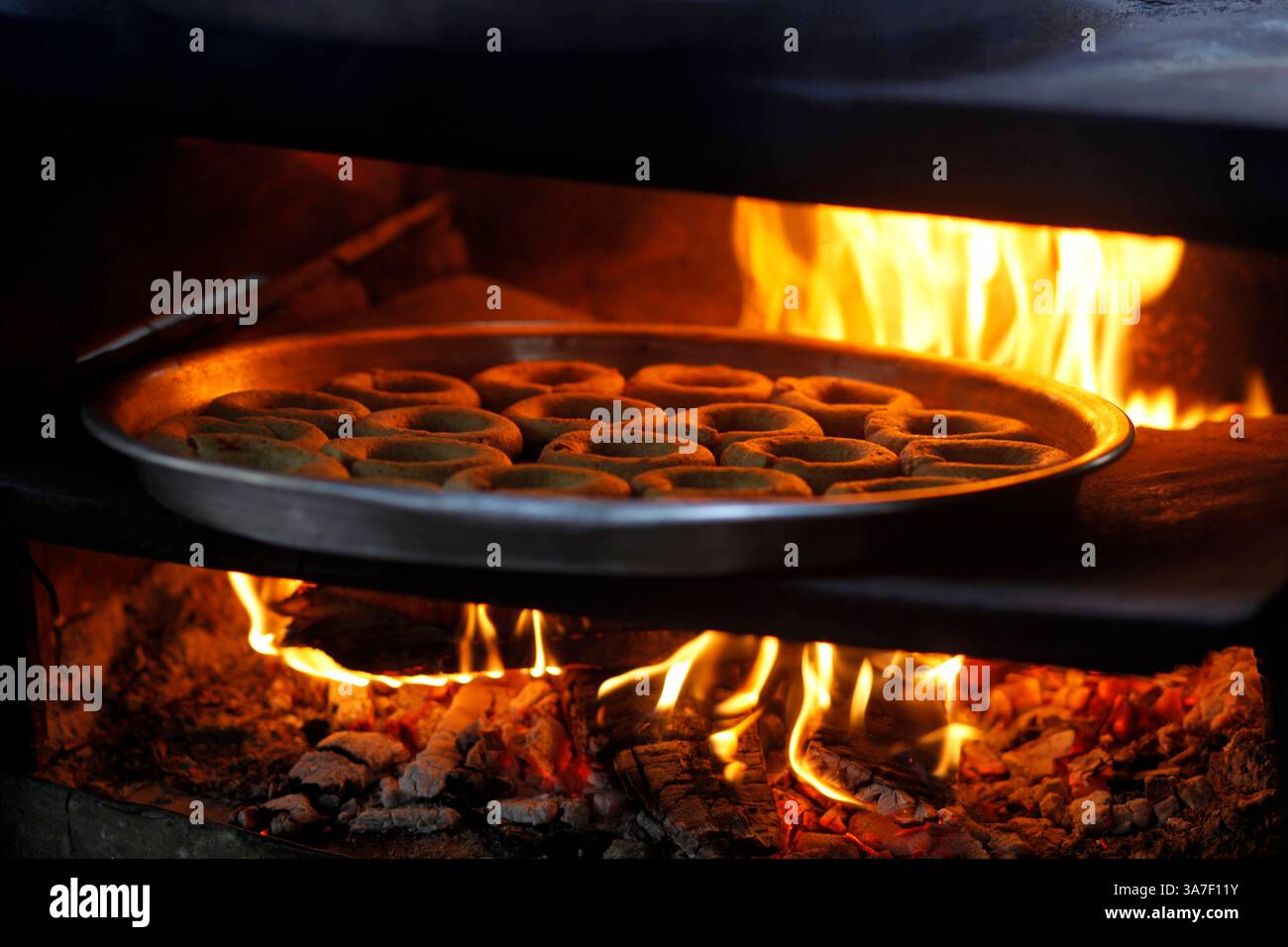 Palestinian families prepare the traditional cookies ahead of Eid al ...