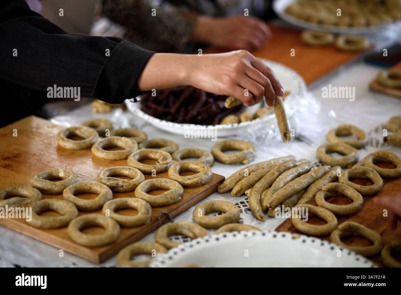 Palestinian families prepare the traditional cookies ahead of Eid al ...