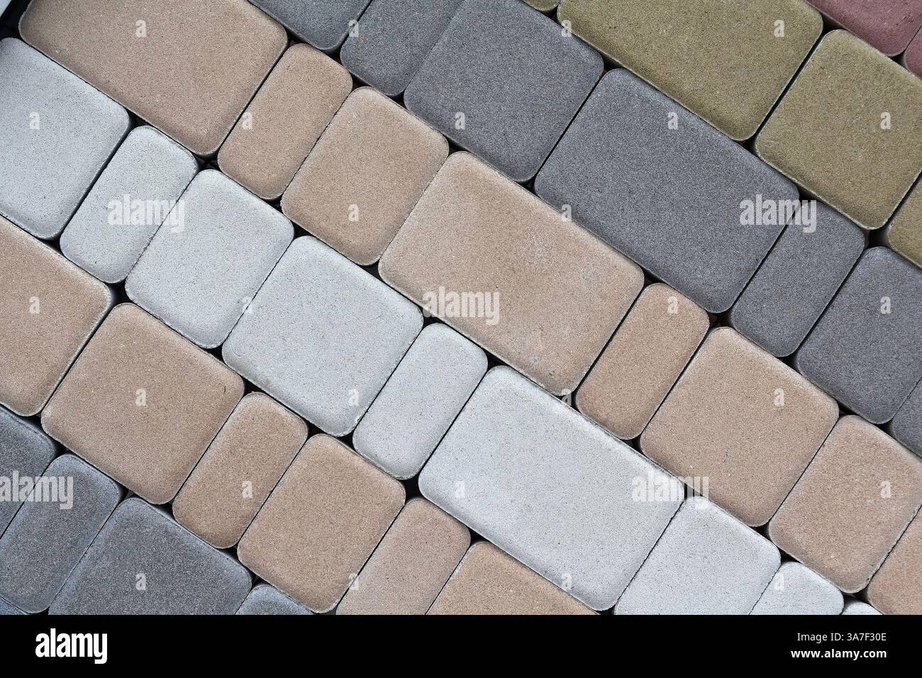 Paving slabs for road paving by mosaic on shop window. Construction ...