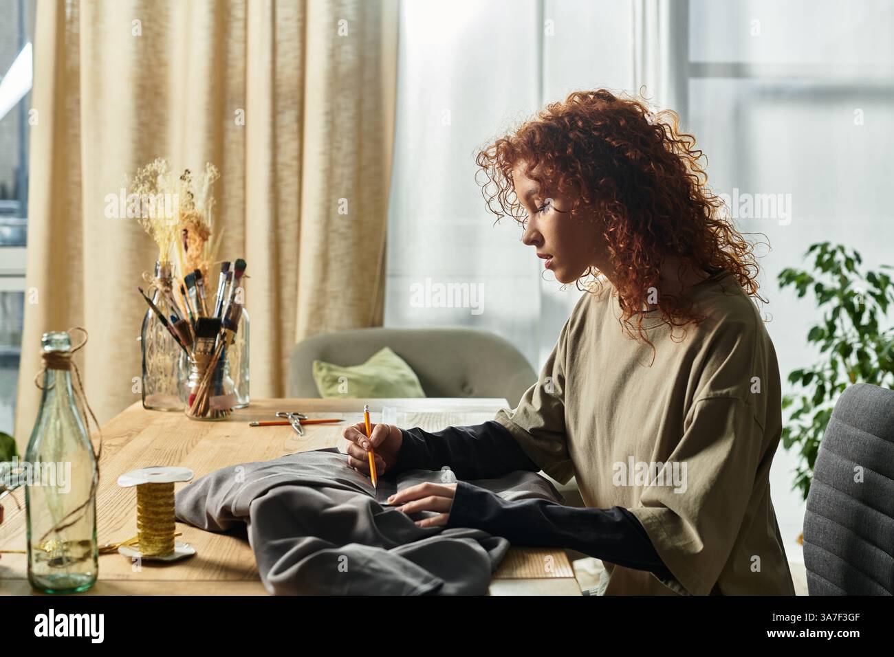 Creative young woman engages in DIY crafting, designing unique fabric ...