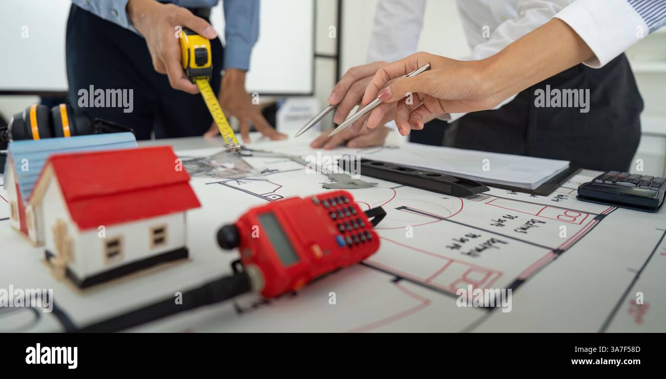 Design and Collaboration. Team actively engaged in drafting building ...