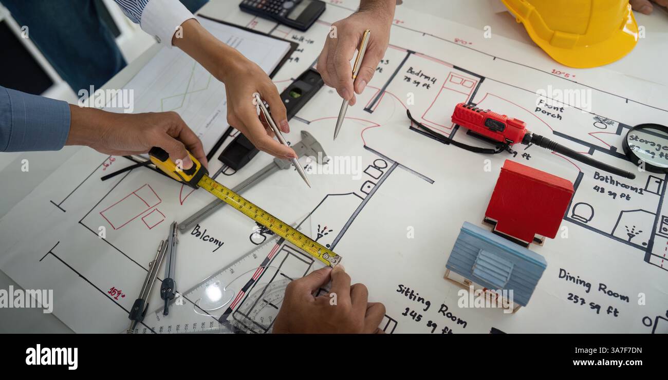 Architecture and Collaboration. Construction team analyzing design ...