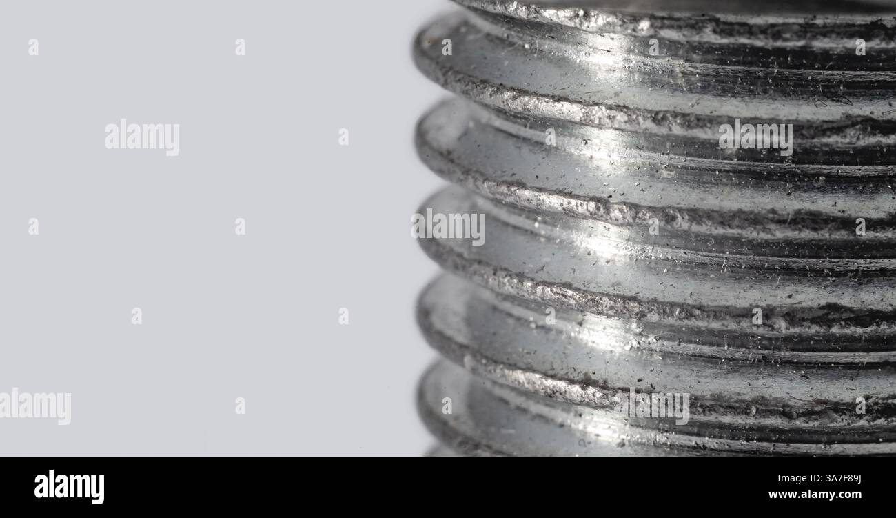 Macro view of worn metal screw threads on gray background for ...
