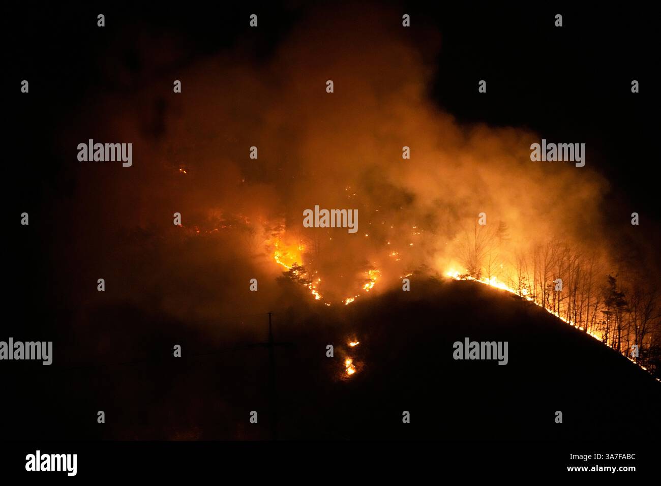 A view of a wildfire burning in the mountain in Cheongsong, South Korea ...