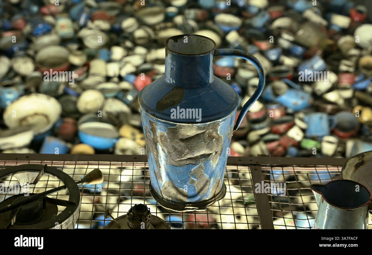 Piles of containers and cookware are piled at the Former Nazi German ...