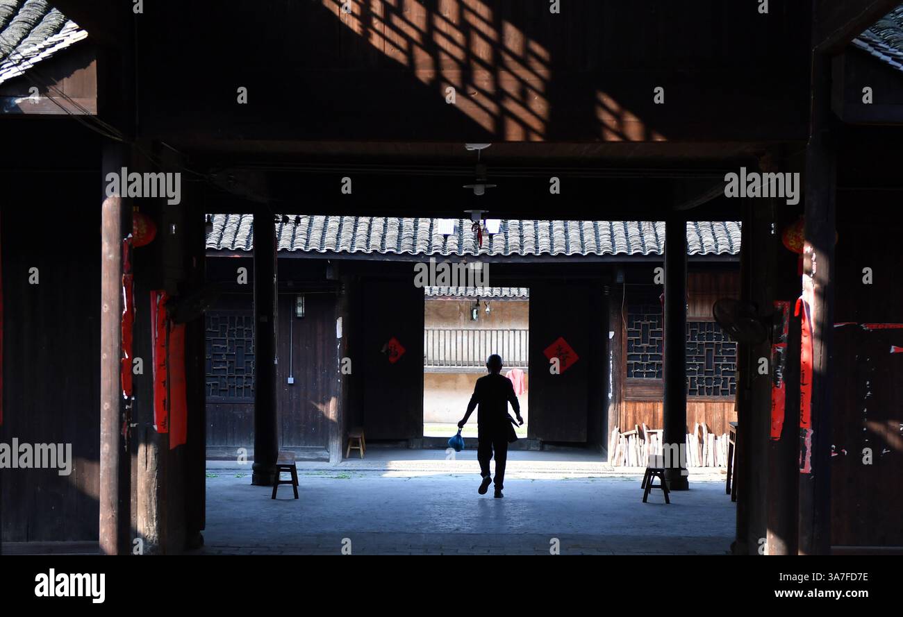 Yongzhou, China's Hunan Province. 25th Mar, 2025. A villager walks at ...