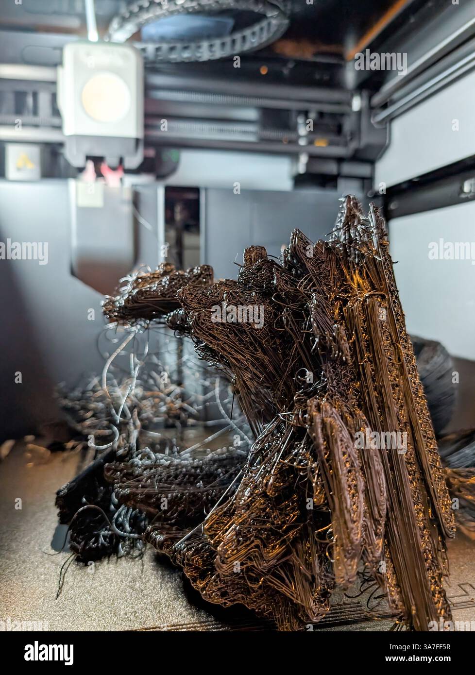 Massive spaghetti failure on a 3D printer caused by high temperatures ...