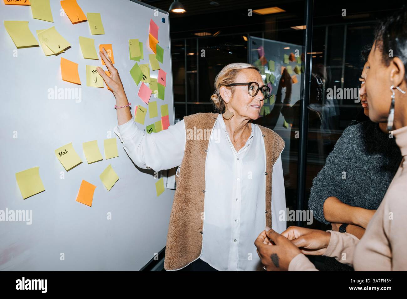 Professor literature explaining students group hi-res stock photography ...