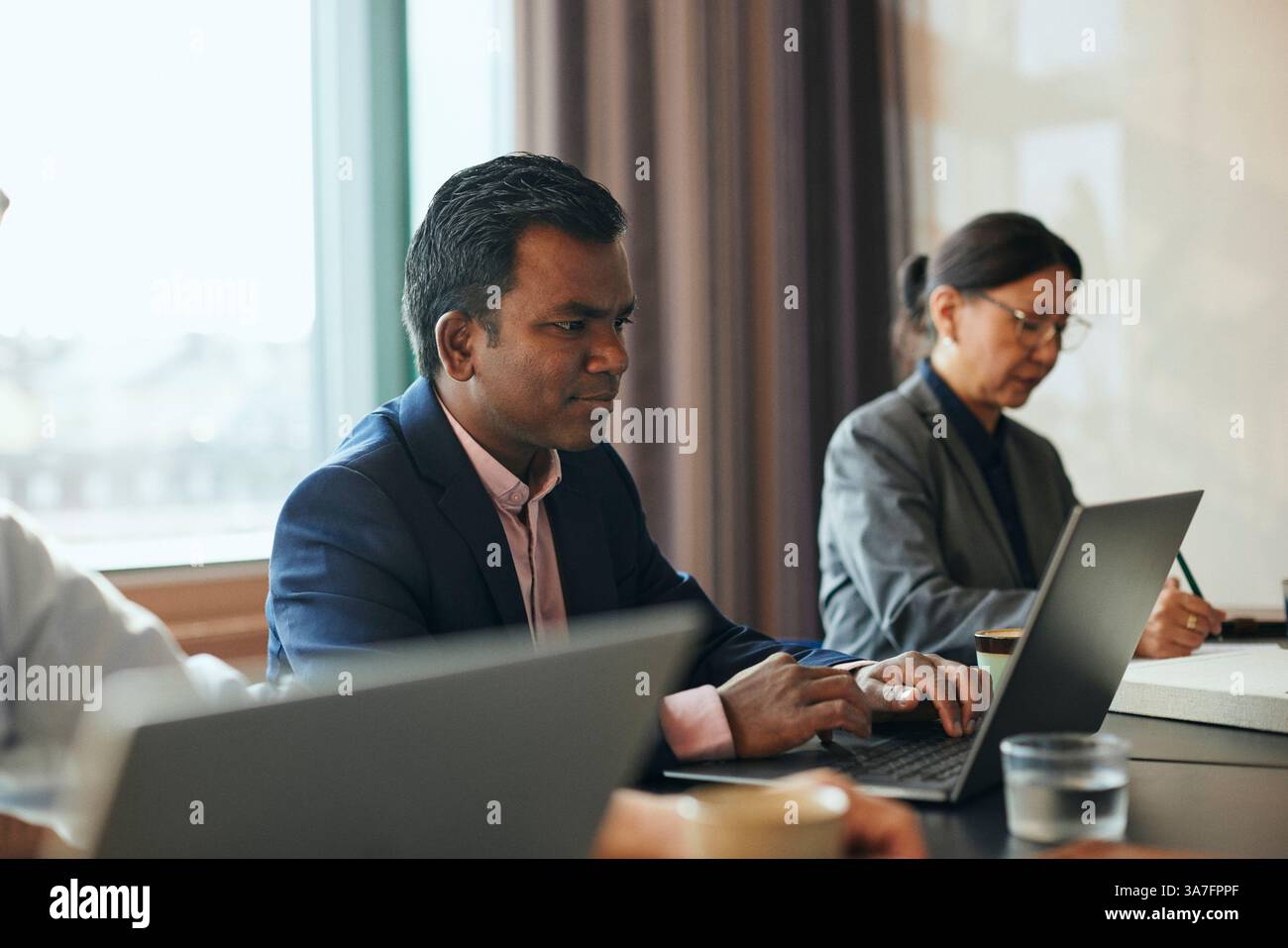 Woman working focused on laptop hi-res stock photography and images - Alamy