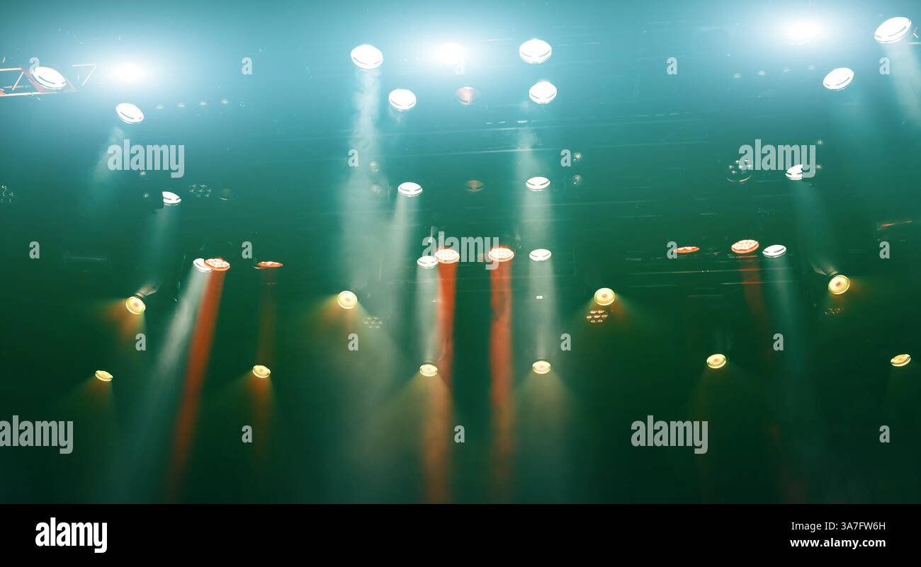 glowing ceiling spotlights lights the stage during the concert Stock ...