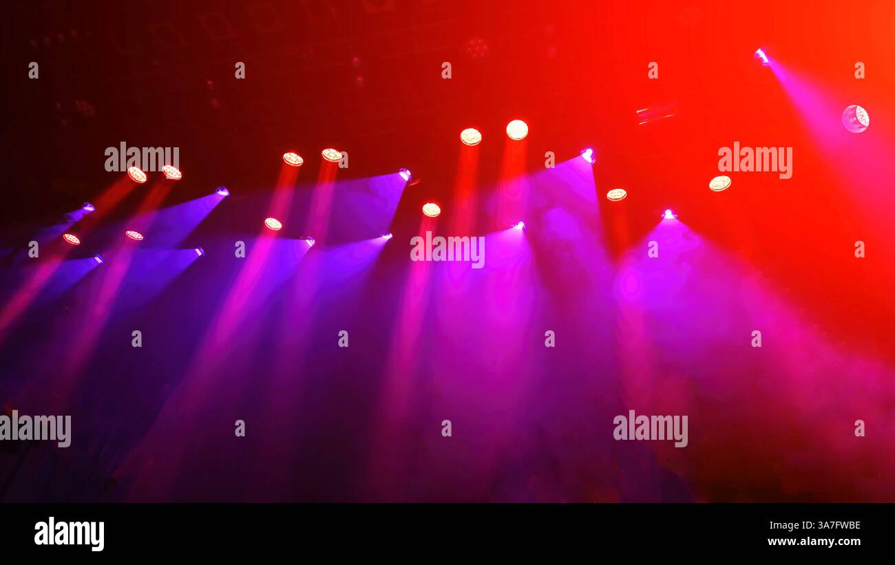 stage light, violet and red spotlights during the concert Stock Photo ...