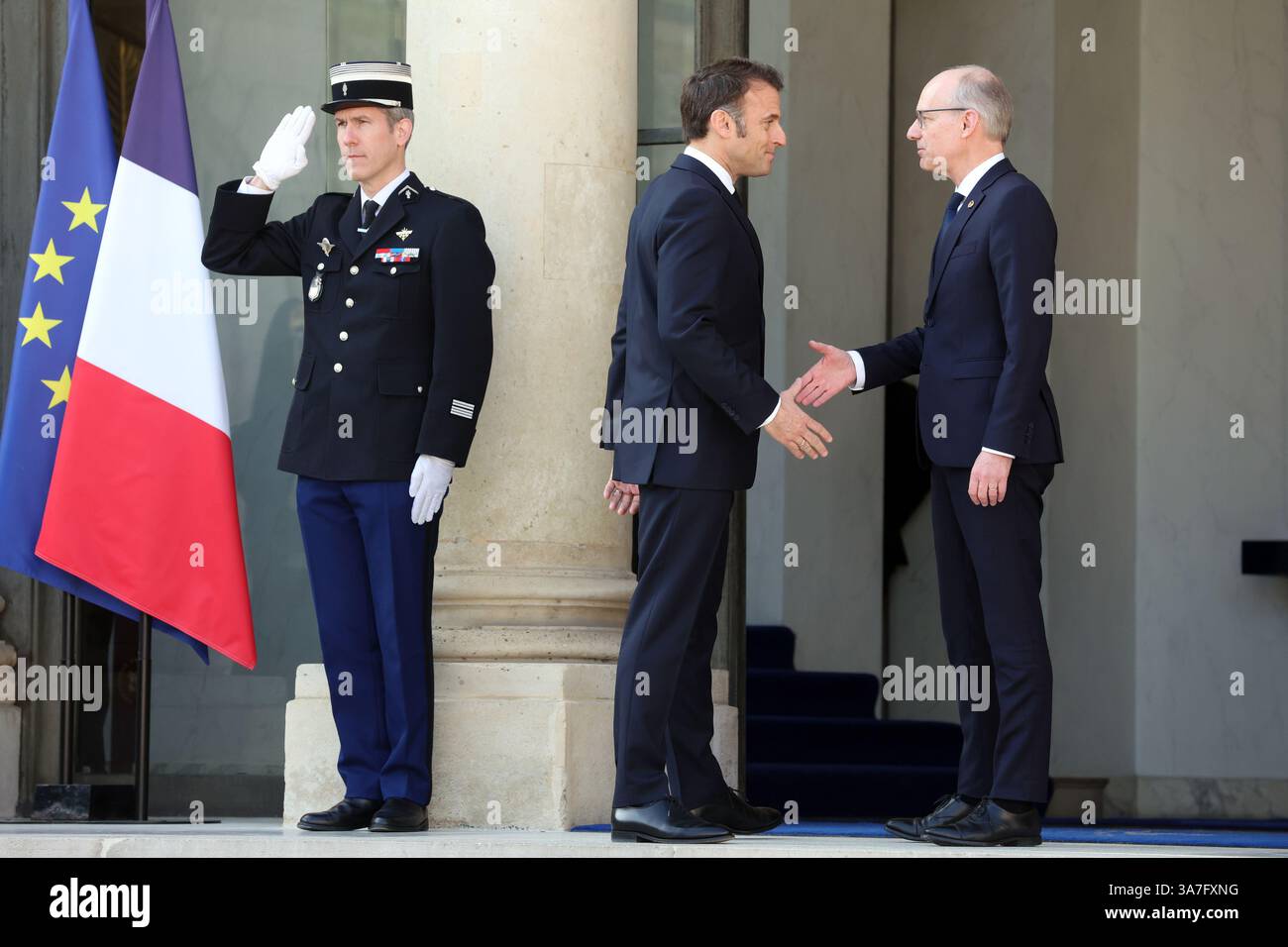 Paris, France. 27th Mar, 2025. French President Emmanuel Macron greets ...