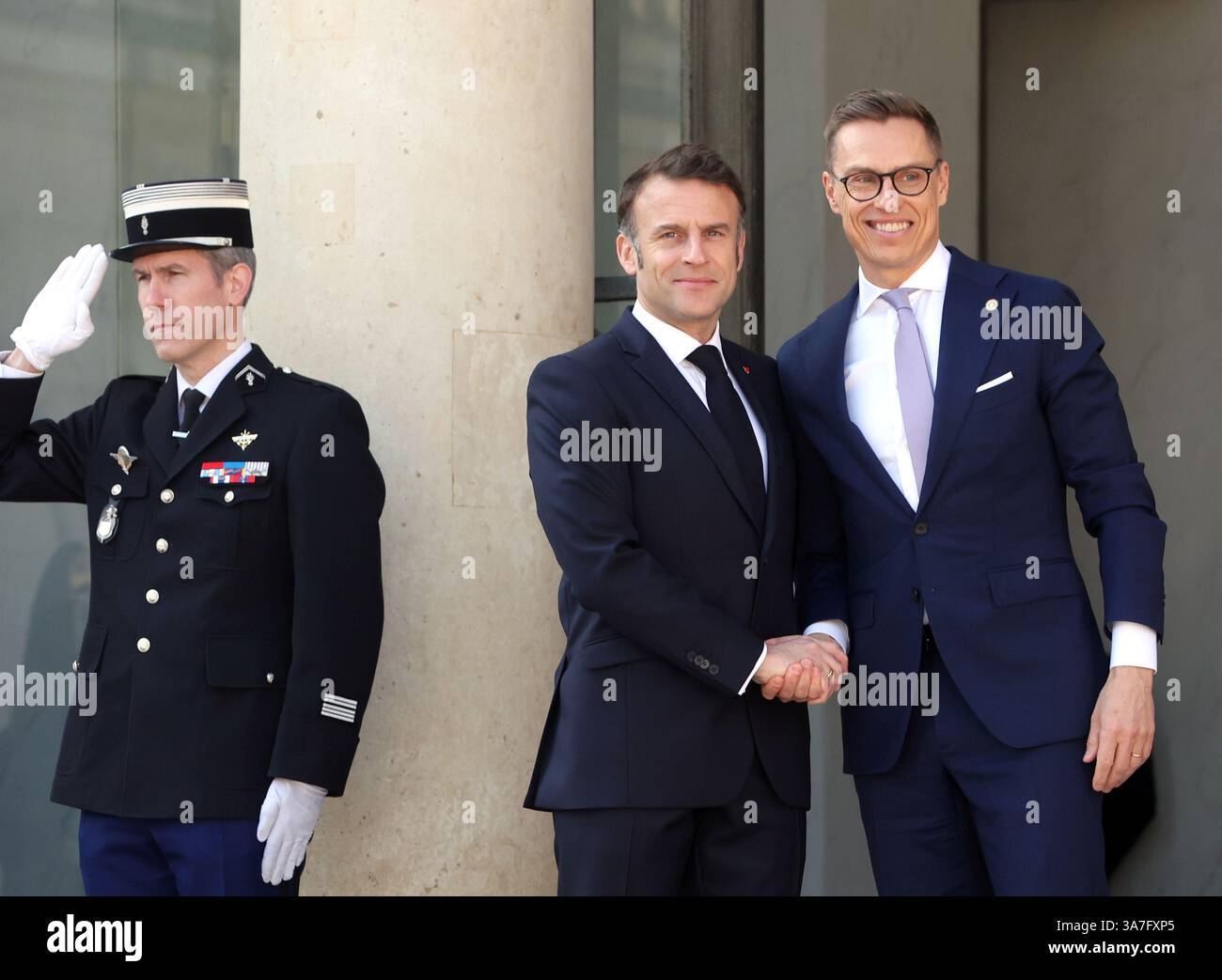 Paris, France. 27th Mar, 2025. French President Emmanuel Macron greets ...