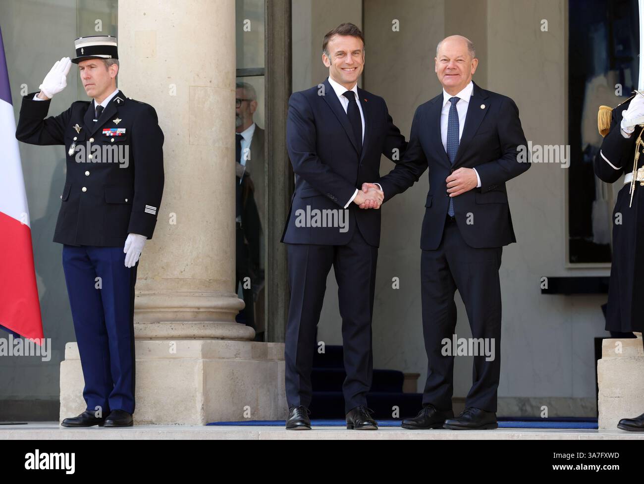 Paris, France. 27th Mar, 2025. French President Emmanuel Macron greets ...