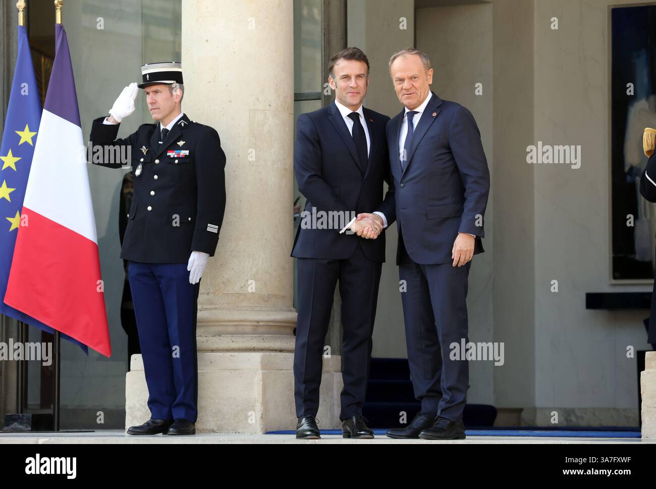 French President Emmanuel Macron greets Polish Premier Donald Tusk at ...