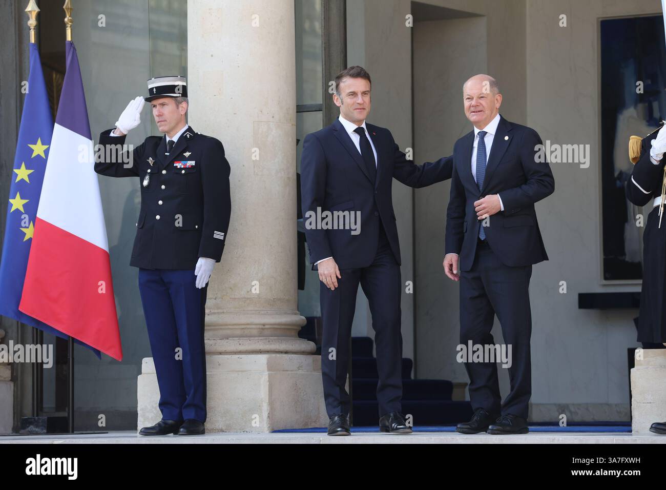 Paris, France. 27th Mar, 2025. French President Emmanuel Macron greets ...