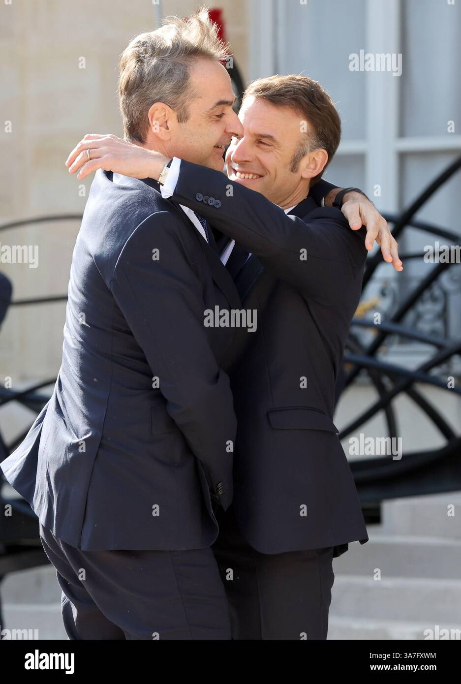 Paris, France. 27th Mar, 2025. French President Emmanuel Macron greets ...