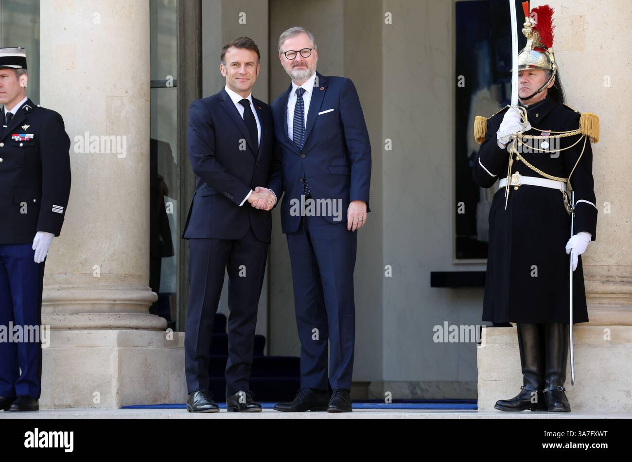 Paris, France. 27th Mar, 2025. French President Emmanuel Macron greets ...