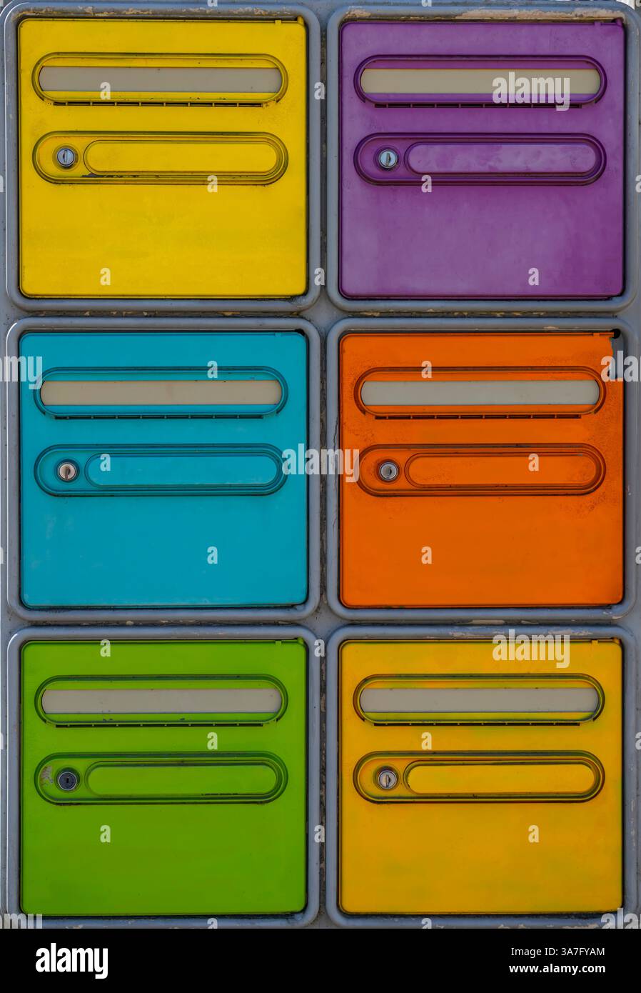 Graphical view of six colorful stacked mailboxes Stock Photo - Alamy