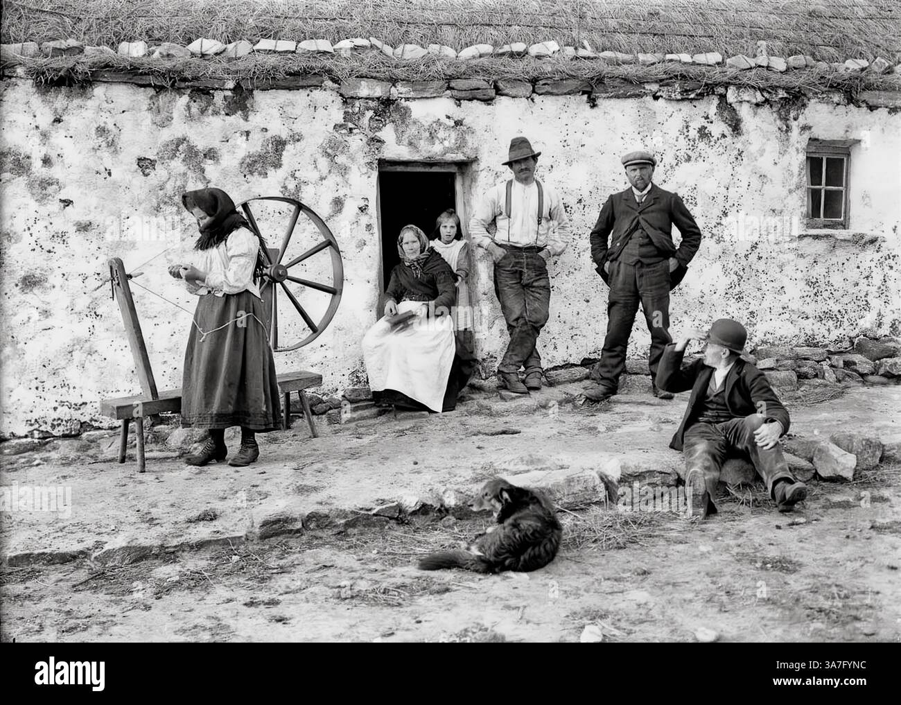 A quintessential Irish family outside their traditional cottage at the ...