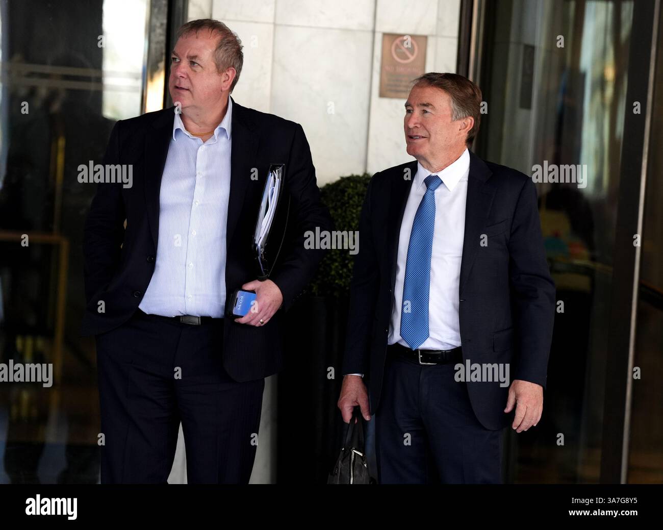 Marc Watts, Everton executive chairman, (right) leaving a Premier ...