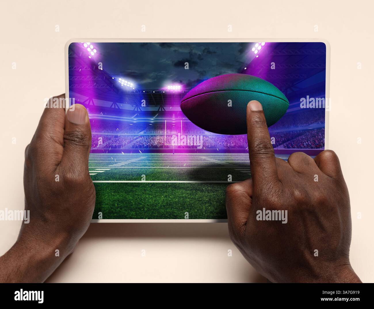 Male hands interacting with tablet screen, playing American football ...