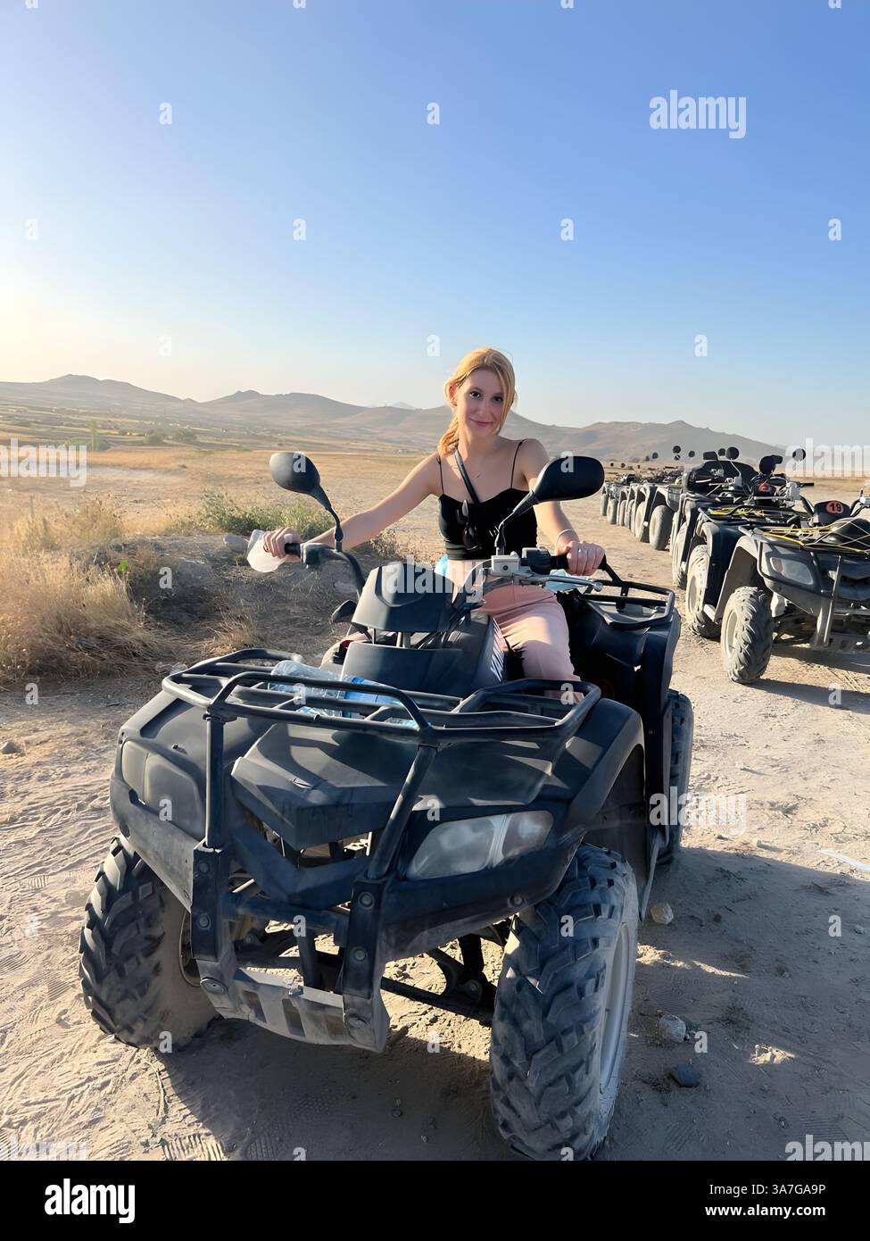 Woman enjoying a desert ATV adventure Stock Photo - Alamy