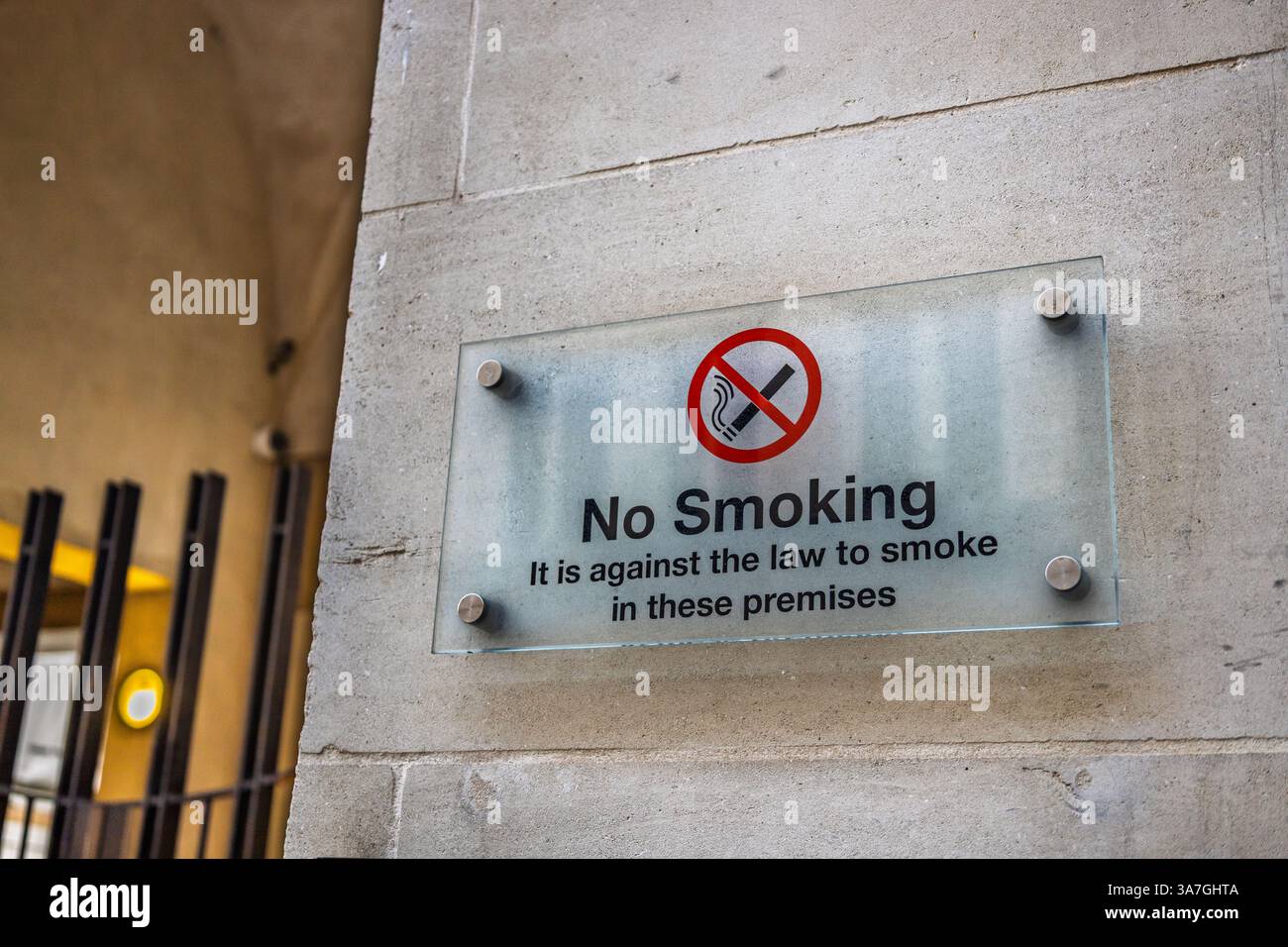 No Smoking Sign on a Wall with Legal Warning in Public Area Stock Photo ...
