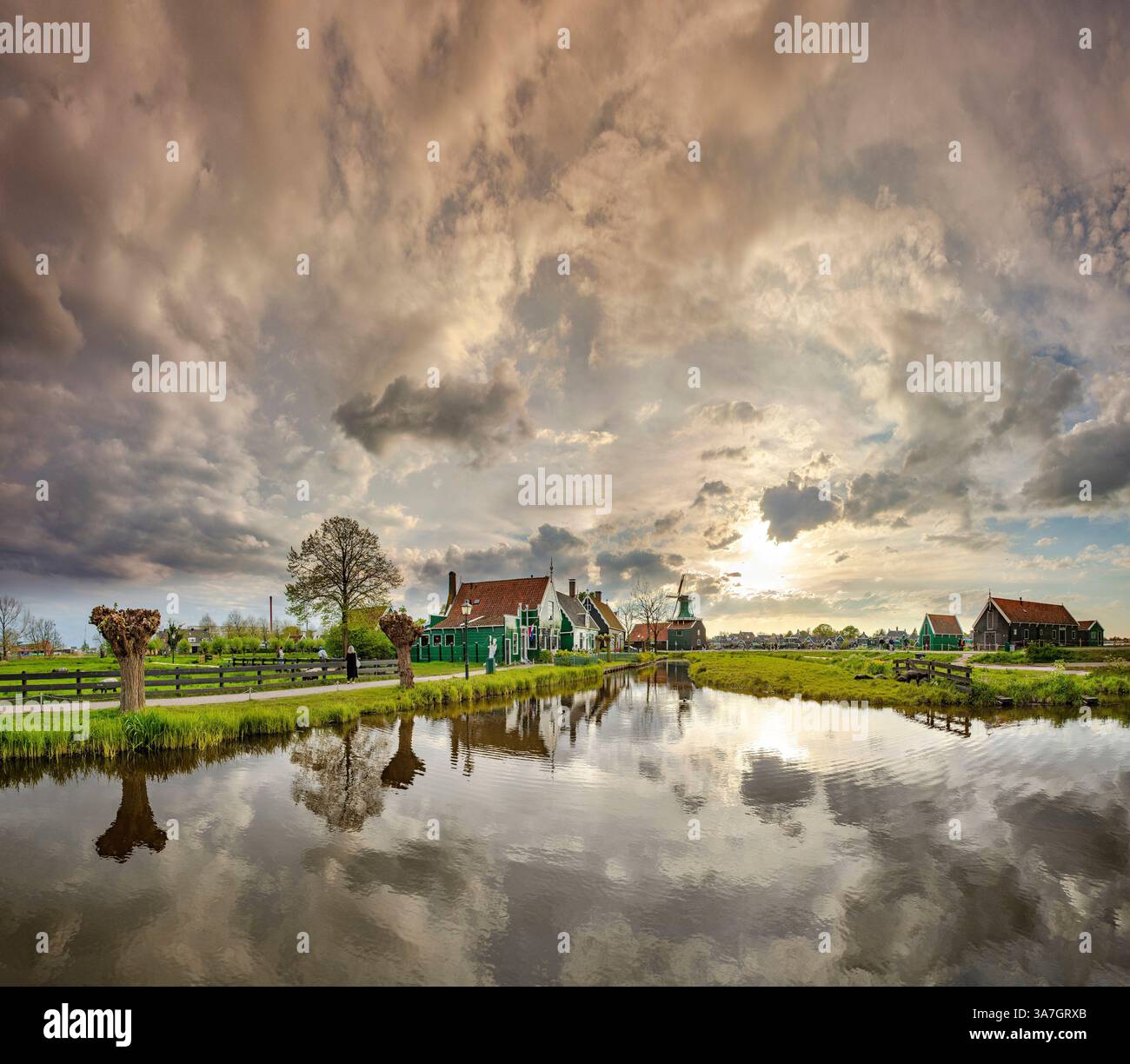 Ditch with arched bridge at Zaanse Schans, windmill De Huisman, Zaandam ...