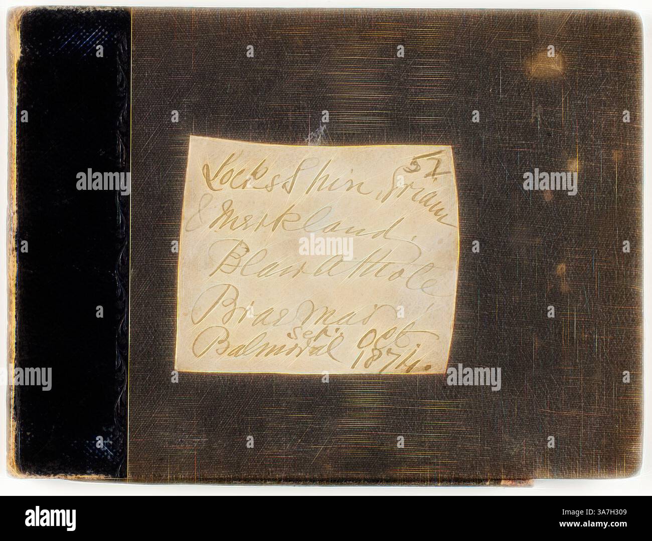 A worn cover of a book, featuring a handwritten label that reads "Locks ...