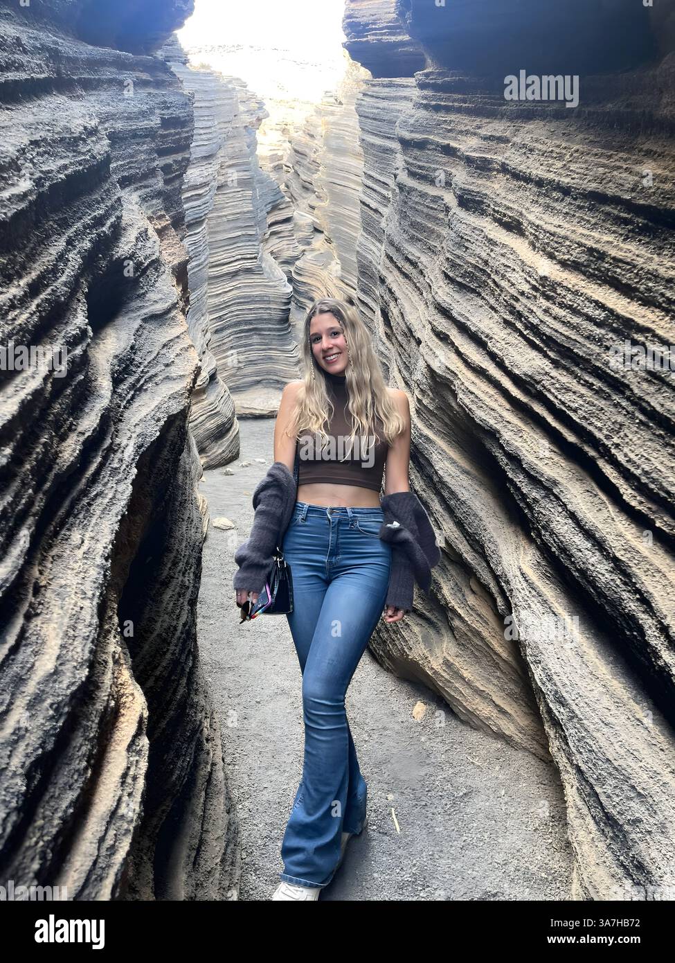 Woman hiker rock tunnel hi-res stock photography and images - Alamy