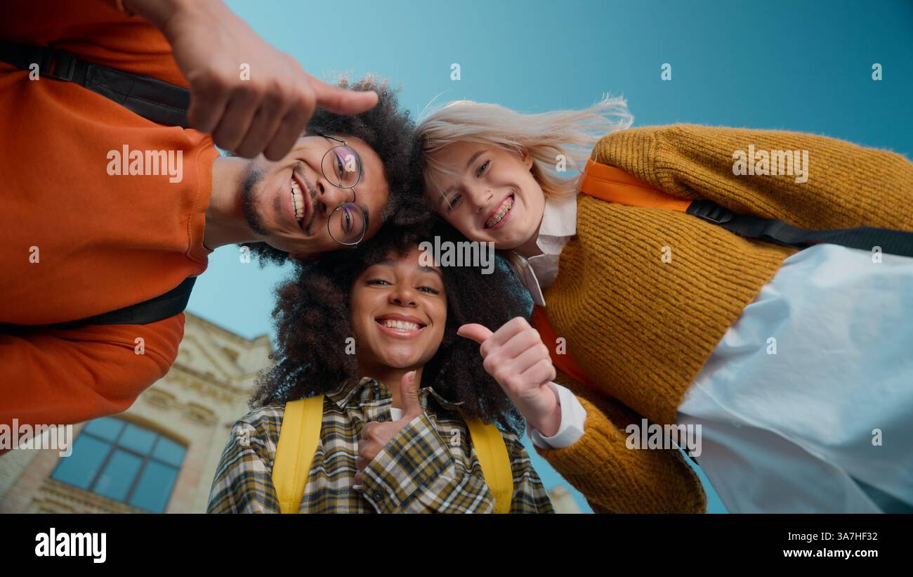 Bottom view smiling happy multiracial friends three students girls ...