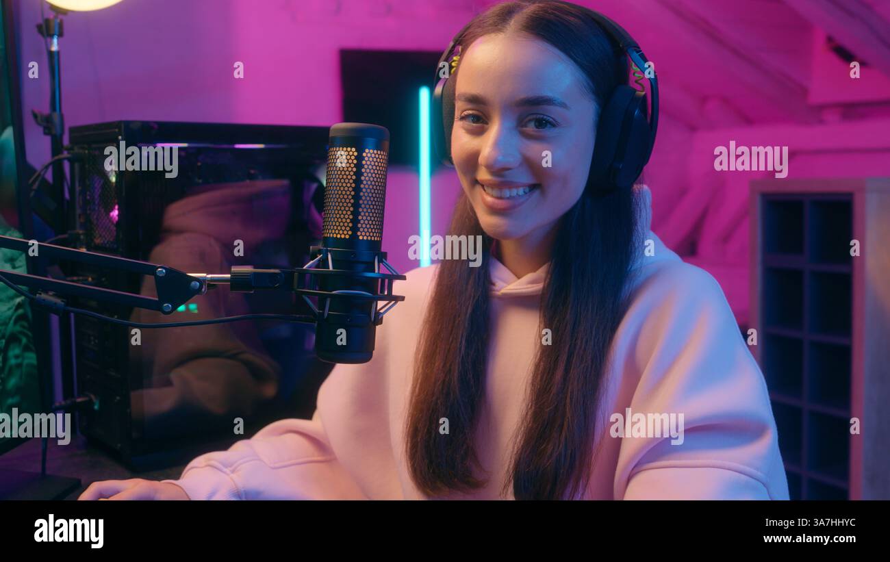 Caucasian happy smiling gamer girl with microphone e-sport online ...