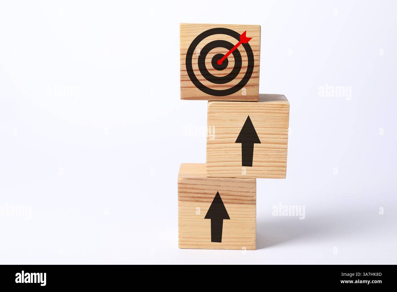 Targeting. Stacked cubes with arrows pointing at one with bullseye on ...