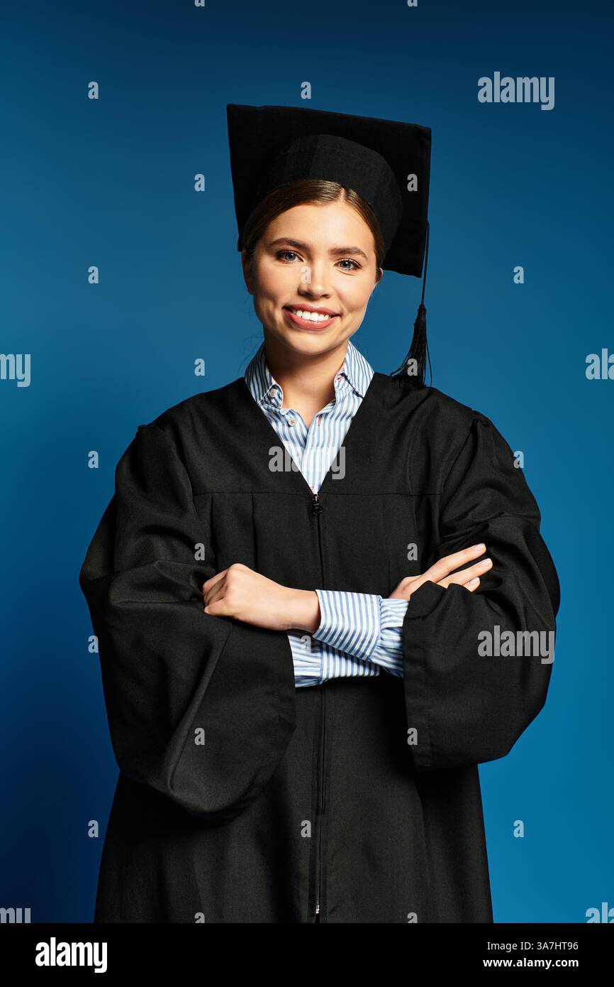 A young woman confidently celebrates her achievement in her graduation ...
