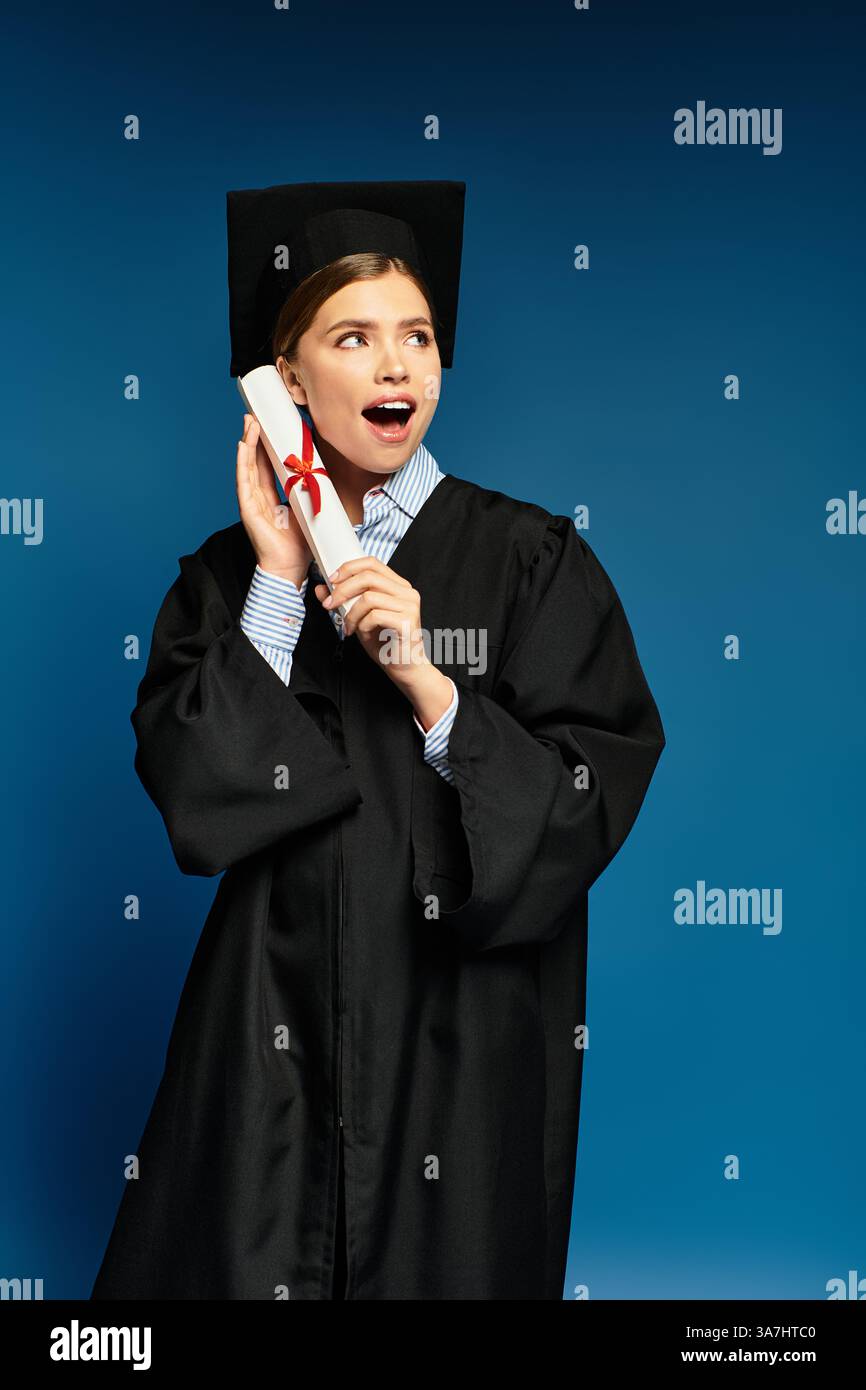 Woman celebrating graduation holds hi-res stock photography and images ...