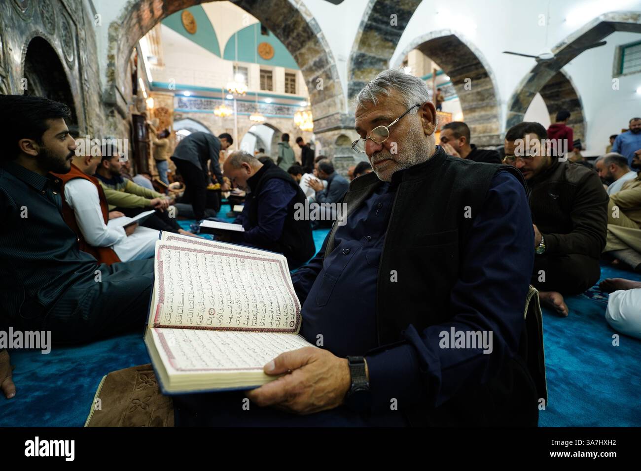 March 27, 2025, Mosul, Nineveh, Iraq: A Sunni Muslim man reads the ...