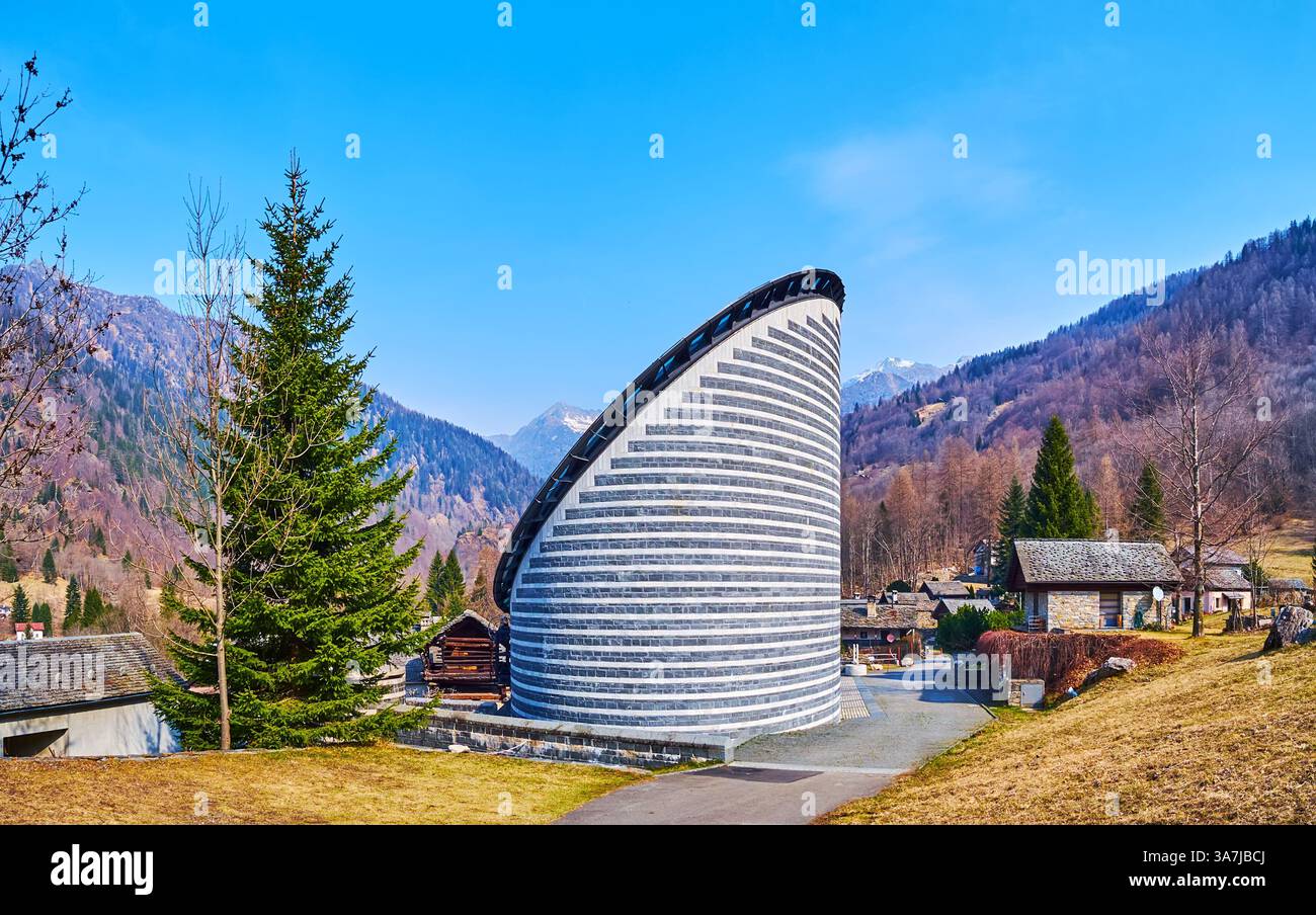Alpine panorama with beautiful stone houses on the mountain slope and ...