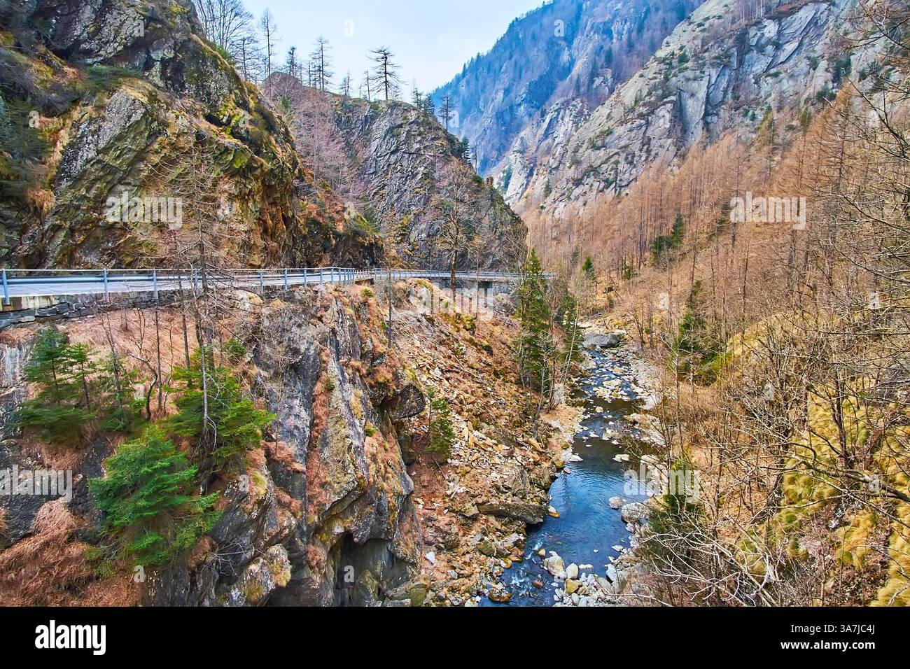The fast flowing River Maggia amid the rocky Lepontine Alps, covered ...