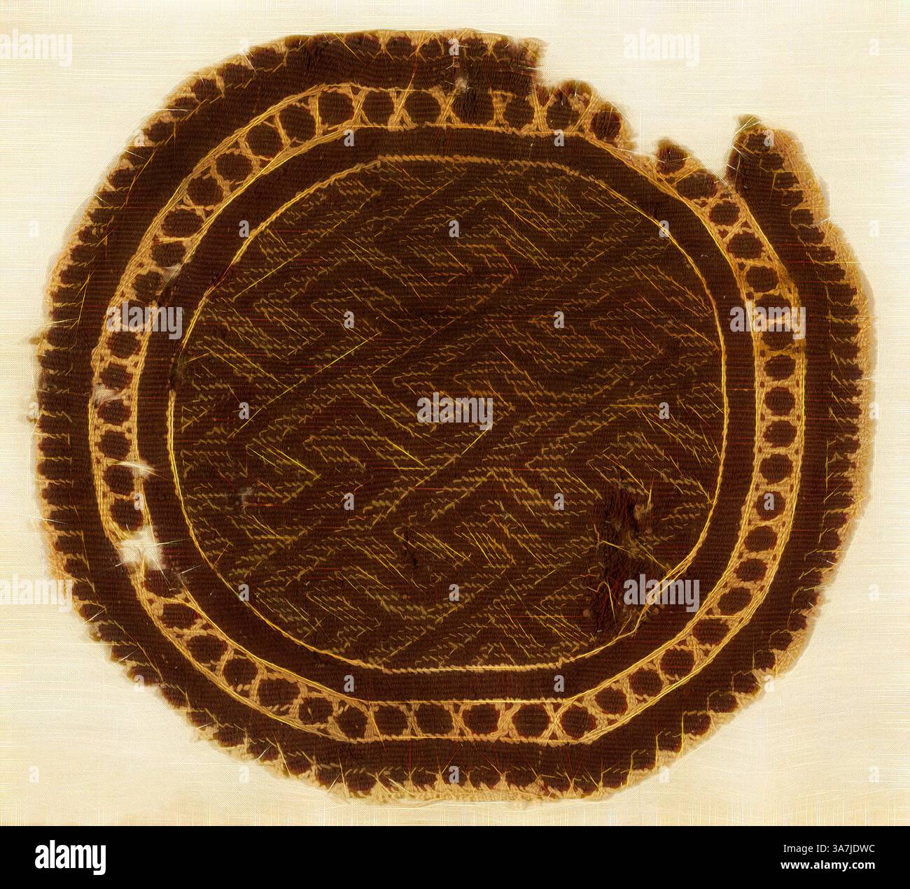 An intricately designed circular textile featuring a complex geometric ...