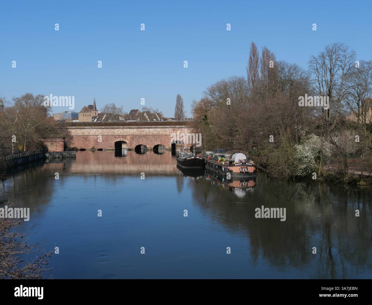 Houseboats on the Ill in front of the Barrage Vauban a historic weir in ...
