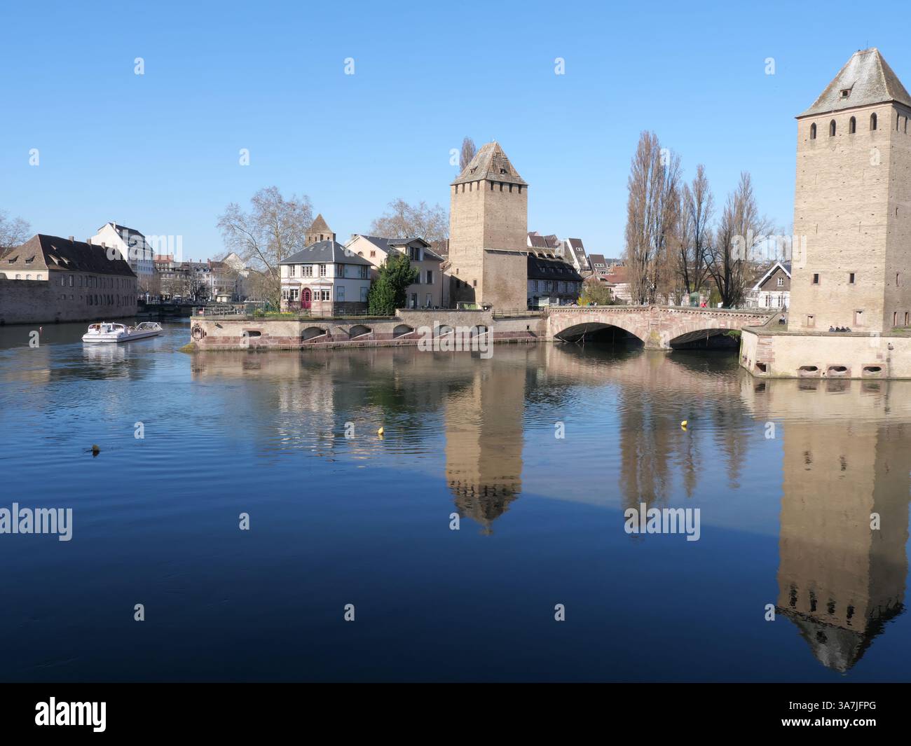The covered bridges in Strasbourg with historic towers and islands on ...