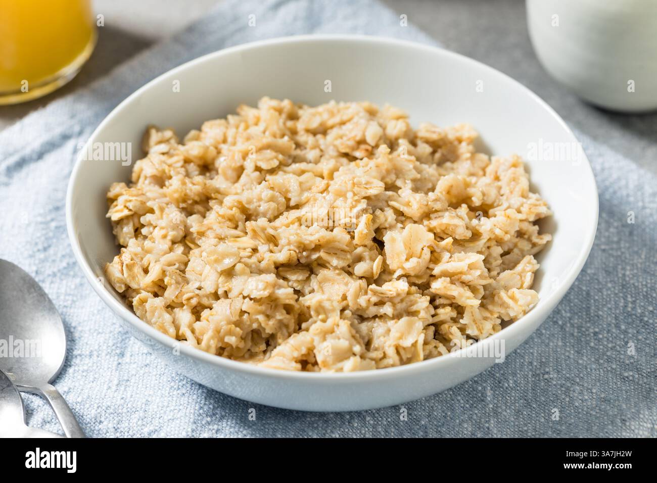 Basic Homemade Rolled Oats Oatmeal in a Bowl for Breakfast Stock Photo - Alamy